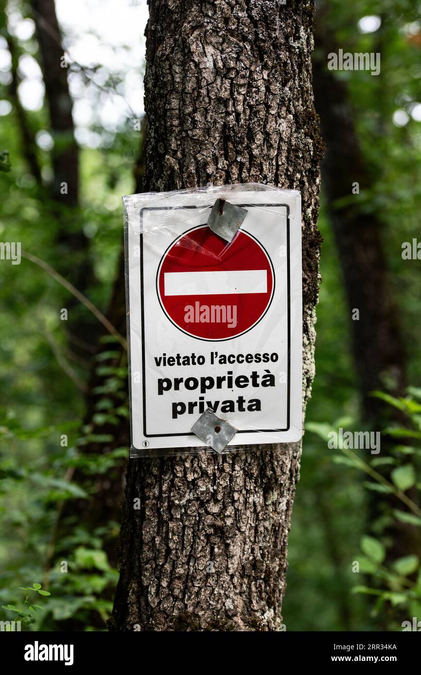 A 'Private Property' sign affixed to a tree, indicating restricted ...