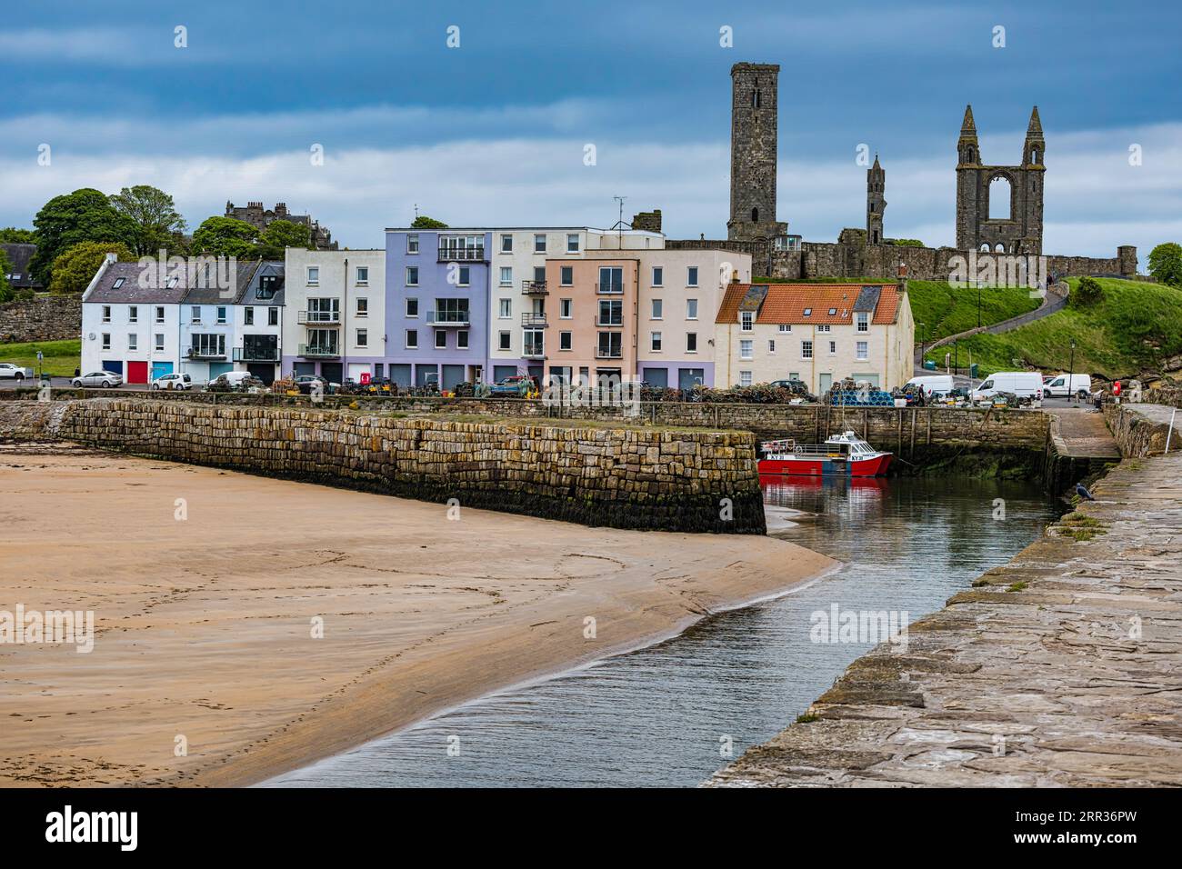 Small harbour with fishing boat and ruins of St Andrews Cathedral, St ...
