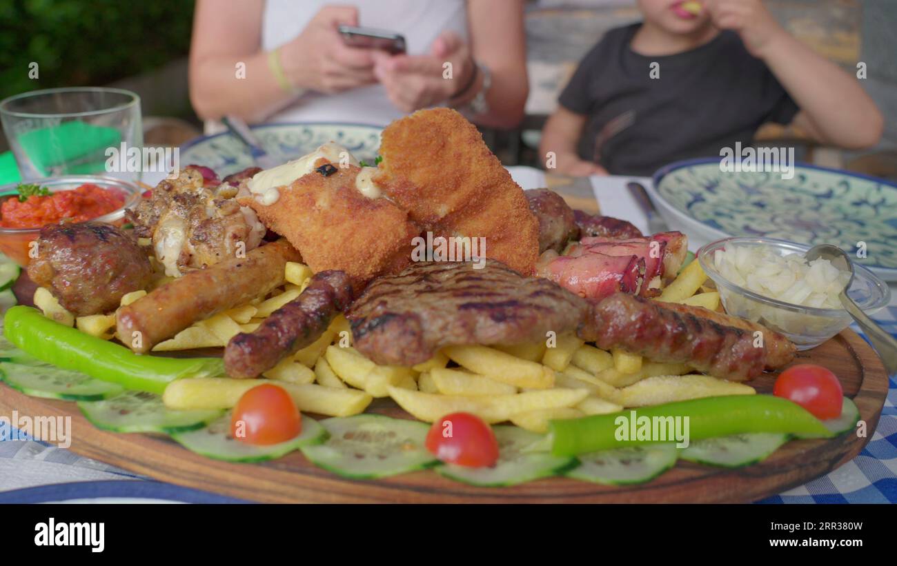 Mediterranean Greek food on display at restaurant table with a variety ...