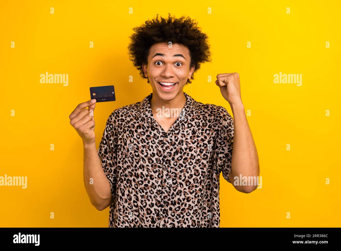 Photo of champion youngster guy fist up hooray hold credit wireless ...