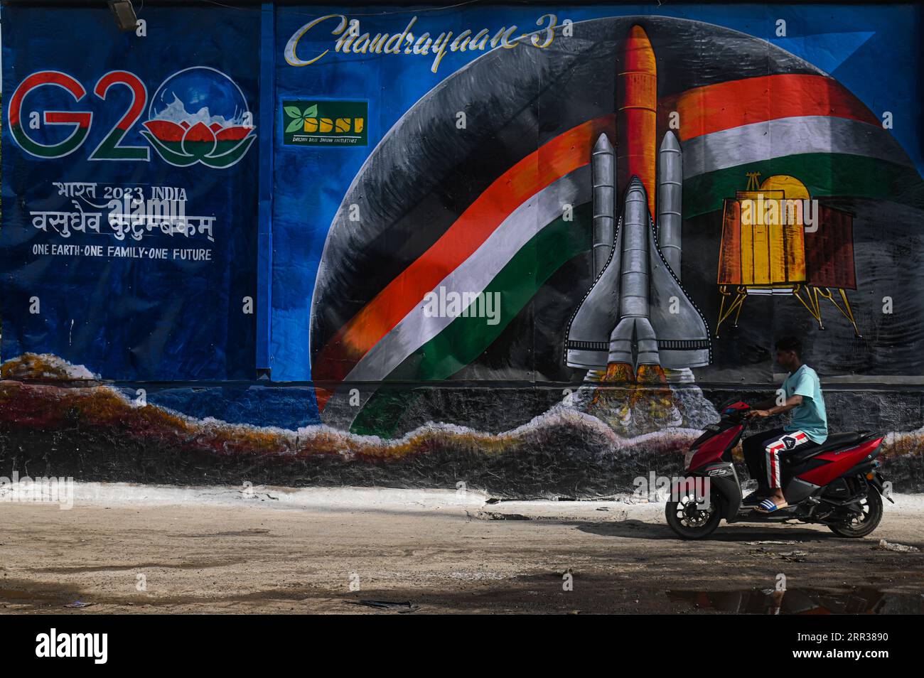 New Delhi, Delhi, India. 6th Sep, 2023. A man on his bike moves past a ...