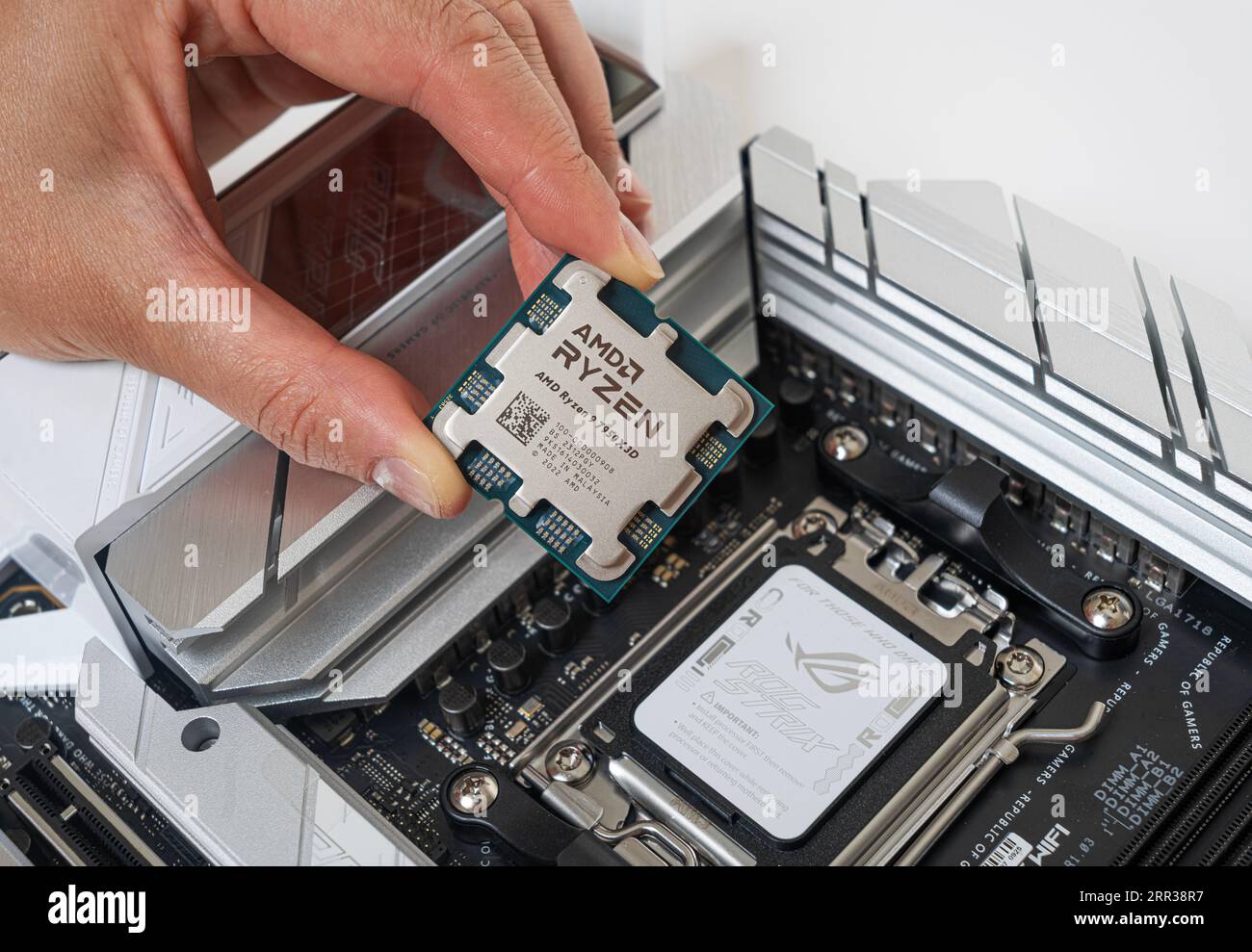 Manual installation of the AMD Ryzen 9 7950X3D processor into the ...