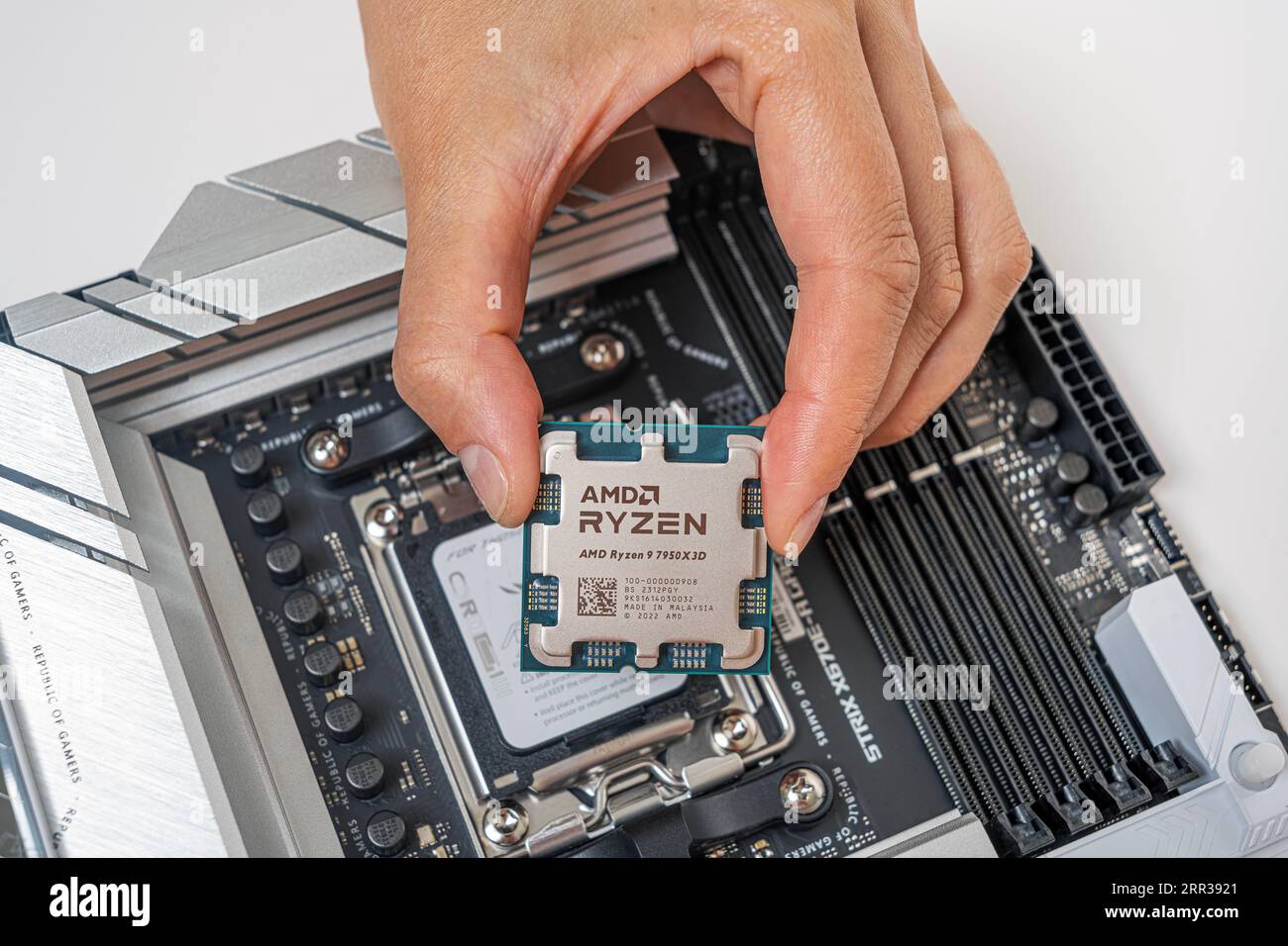 Manual installation of the AMD Ryzen 9 7950X3D processor into the ...