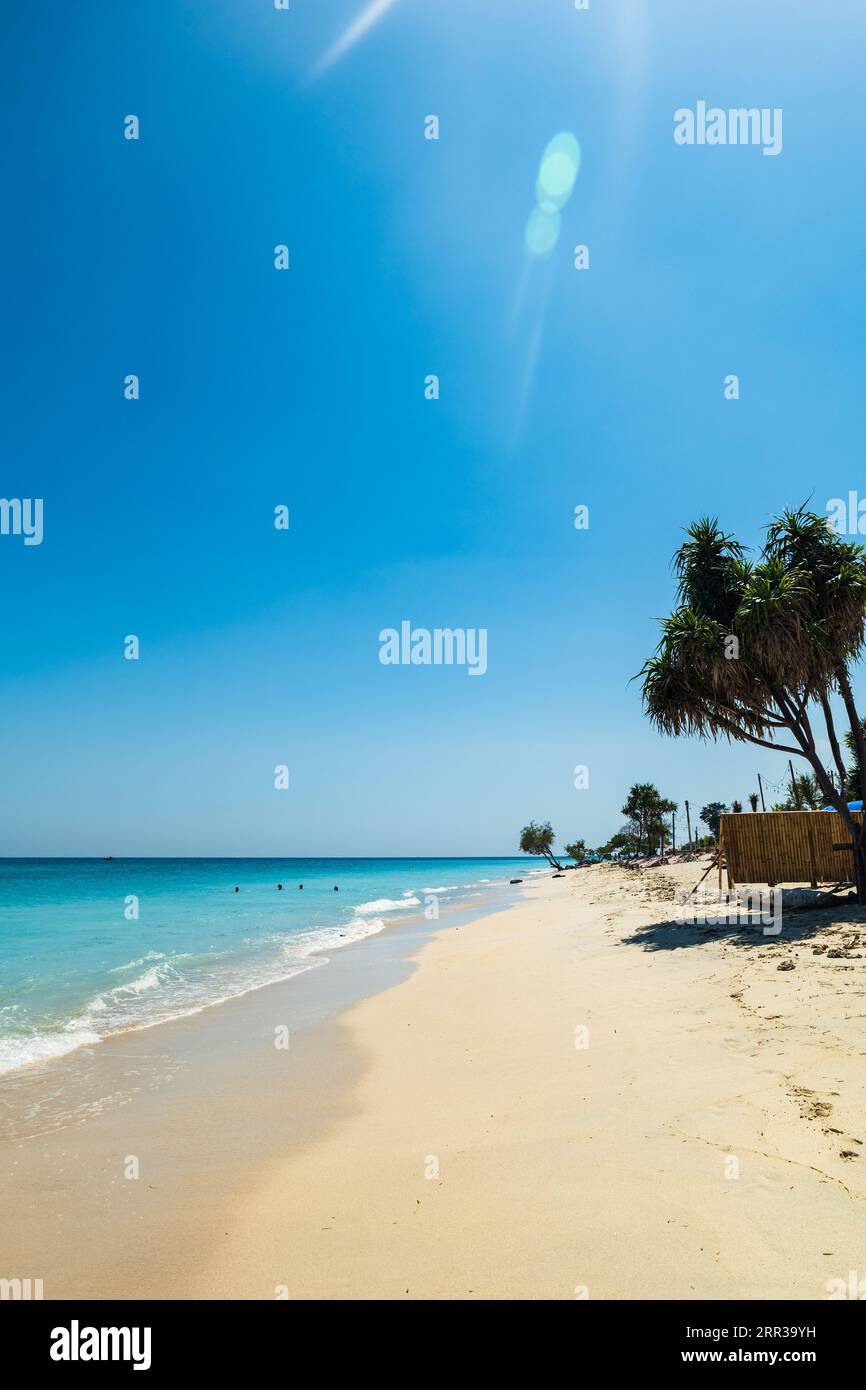Tropical sandy beach with turquoise ocean water at Gili Trawangan, one ...