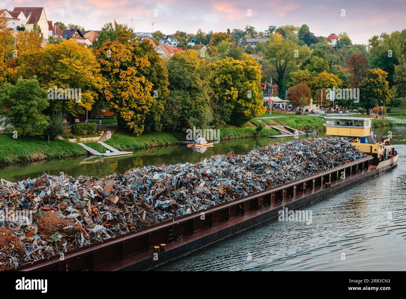 Transportation industry. Ship barge transports scrap metal and sand ...