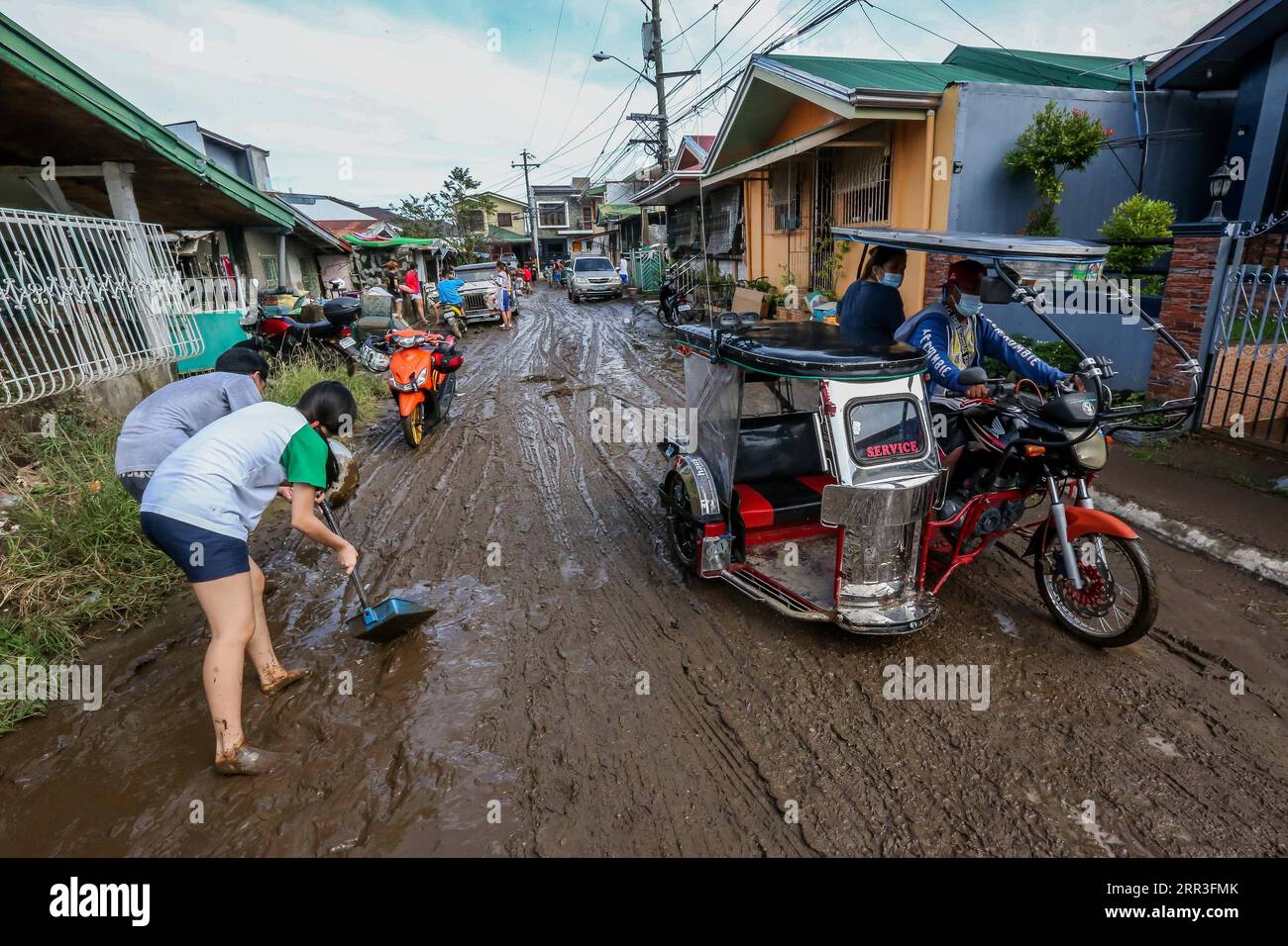 201102 -- BATANGAS PROVINCE, Nov. 2, 2020 -- Residents clean a road ...