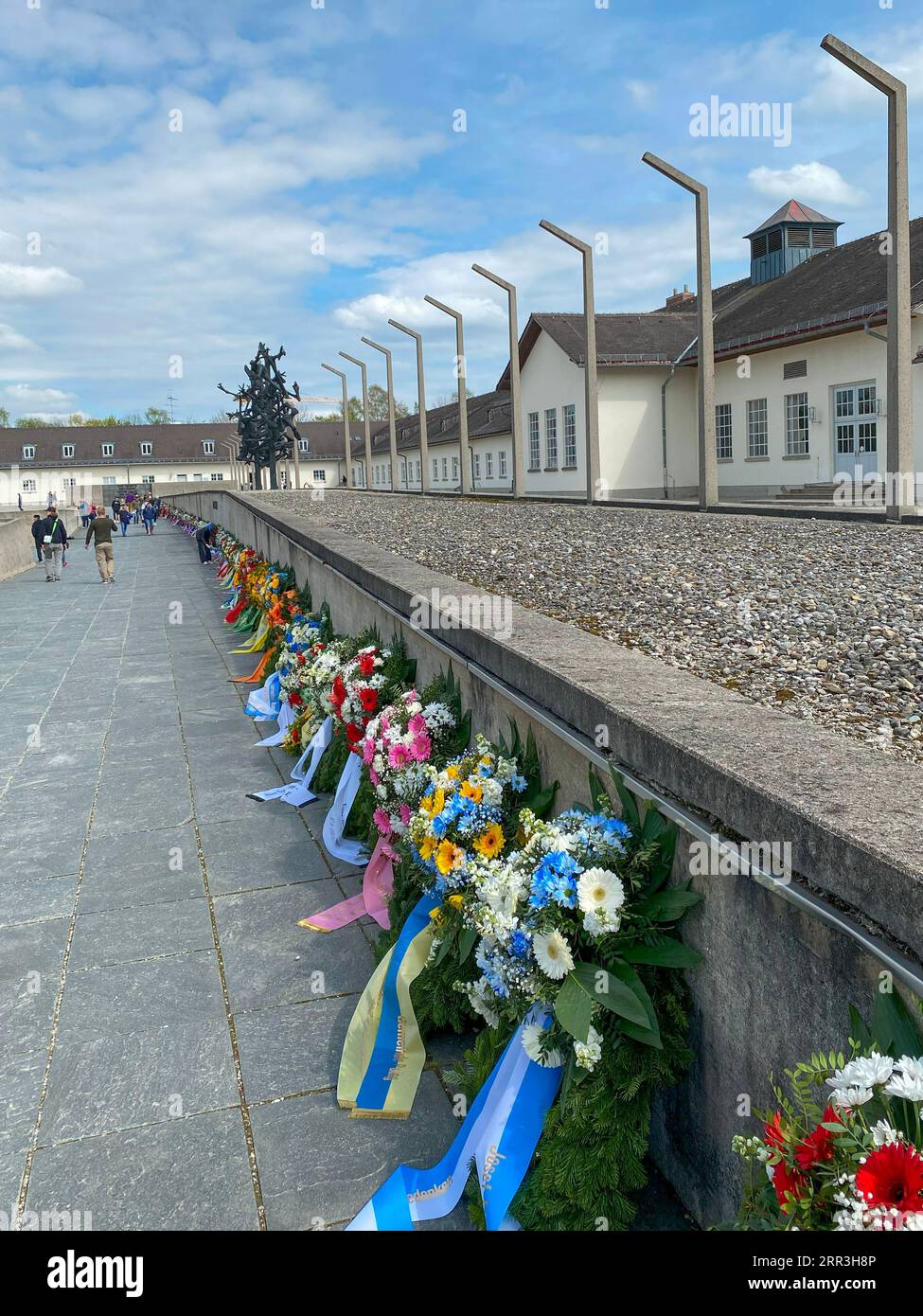 Wreaths of flower lay after a memorial ceremony commemorating the ...
