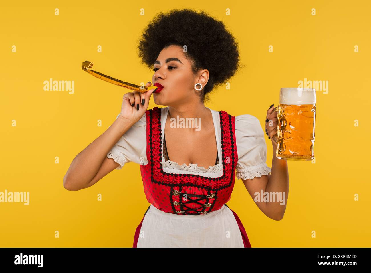 african american oktoberfest waitress with party horn and mug of craft ...