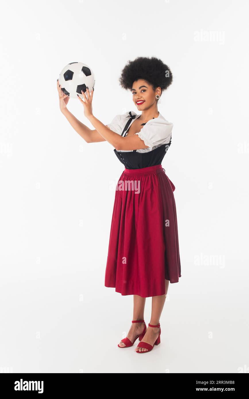 smiling african american bavarian waitress in authentic dirndl dress ...