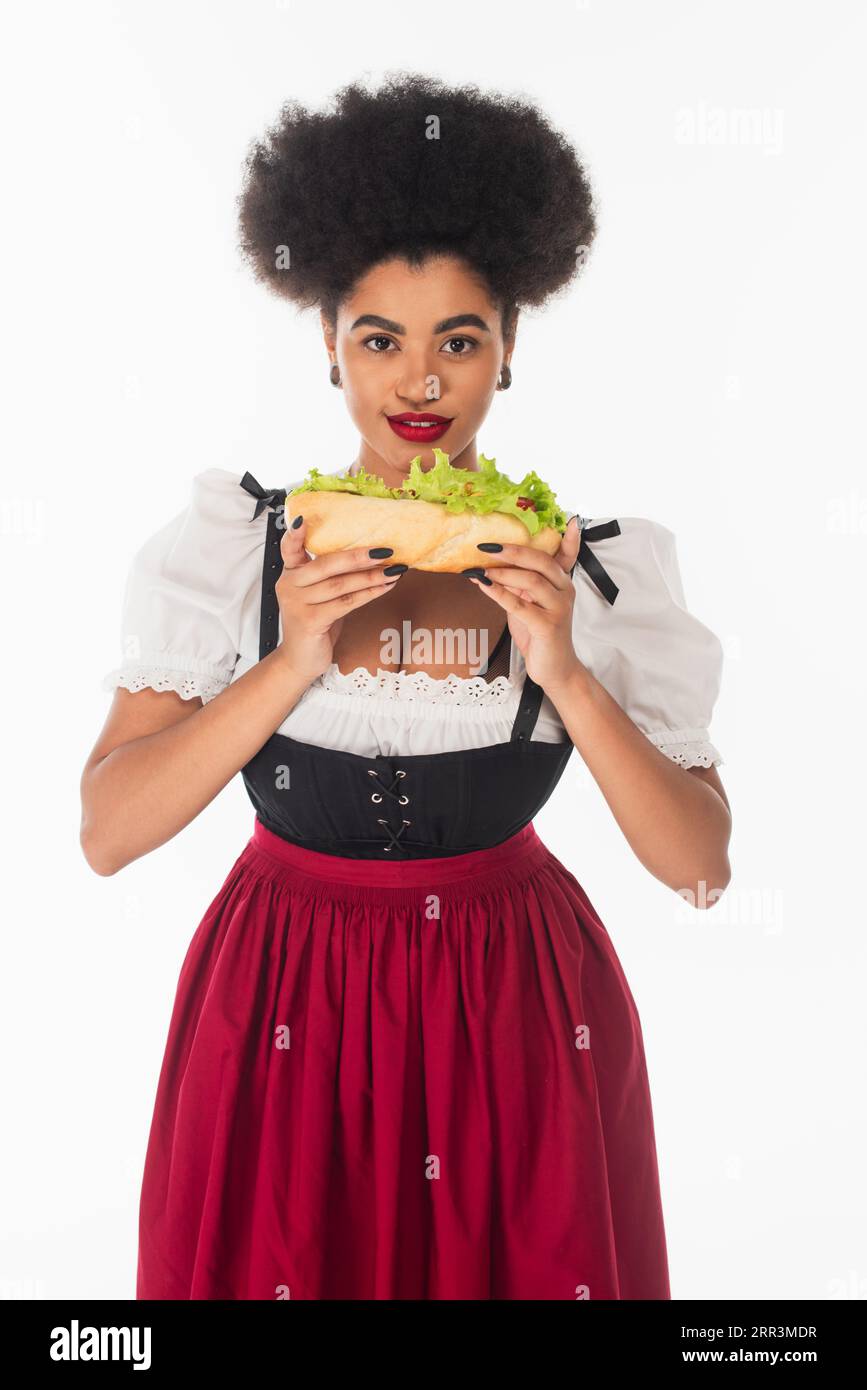 african american oktoberfest waitress in bavarian costume holding hot ...