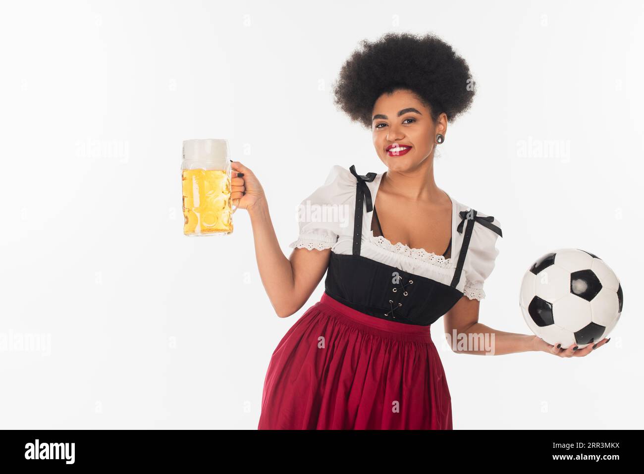 african american oktoberfest waitress with soccer ball and mug of lager ...