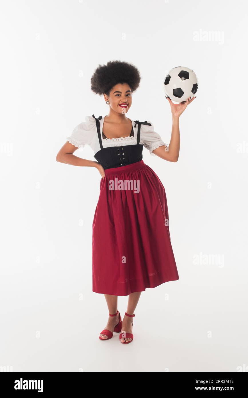 alluring african american bavarian waitress in authentic dress posing ...