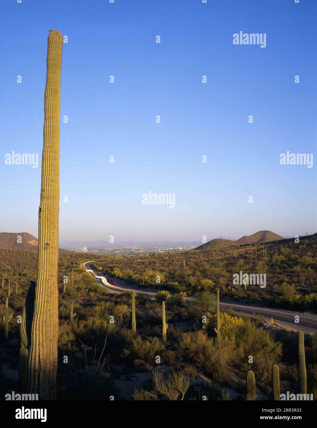 Cars travel along Gates pass road in the Sonoran Desert west of Tucson ...