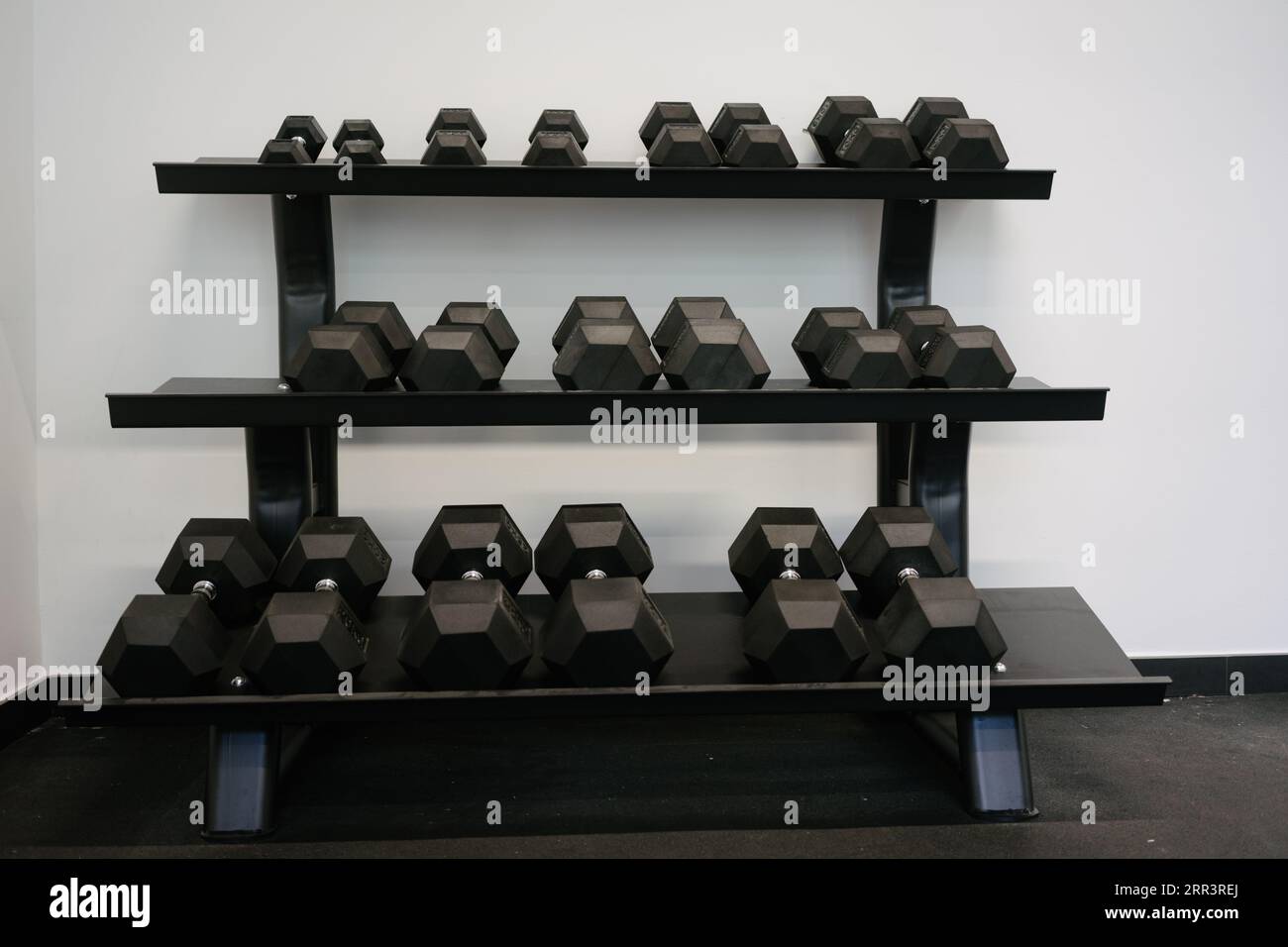Concept: indoor training. Dumbbell rack. Equipment Stock Photo - Alamy
