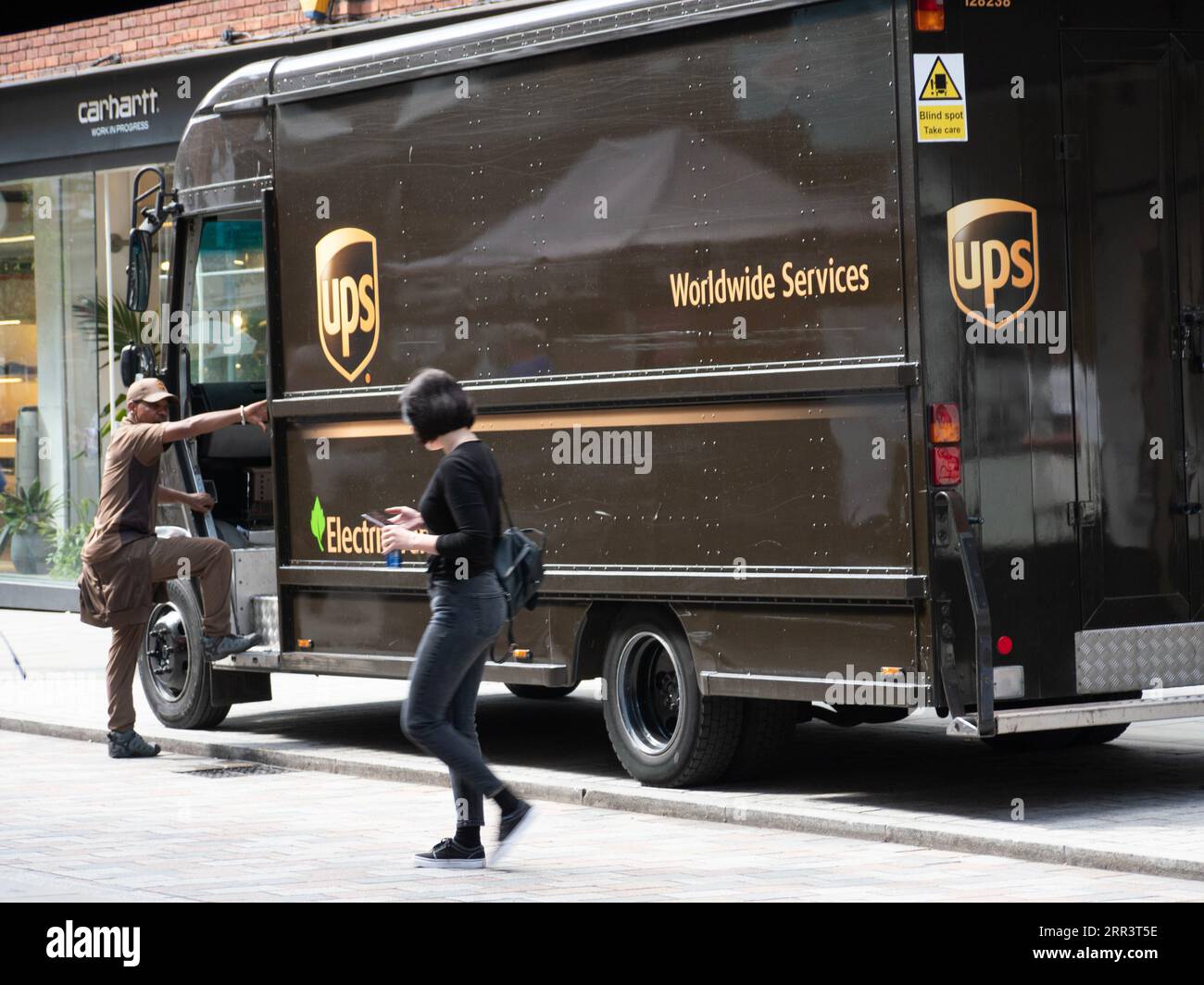 UPS parcel worker with electric van in Seven Dials London UK Stock ...