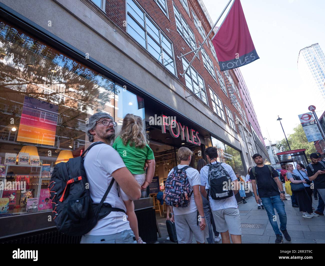 Flag flying outide Foyles bookshop Central London, with crowds of ...