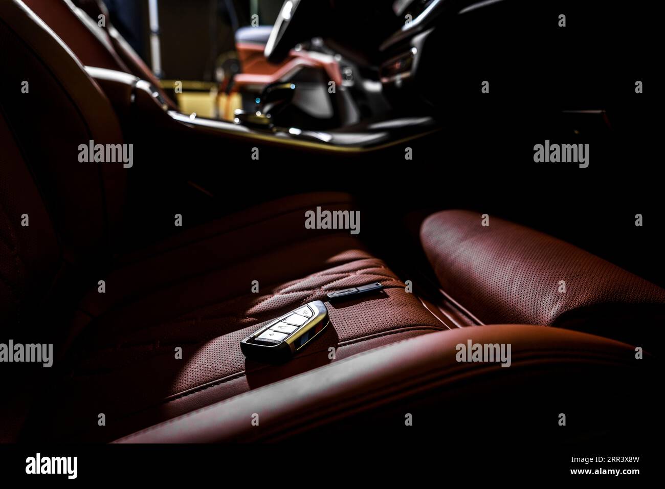 Close-up of a keychain with keys on the seat Stock Photo - Alamy