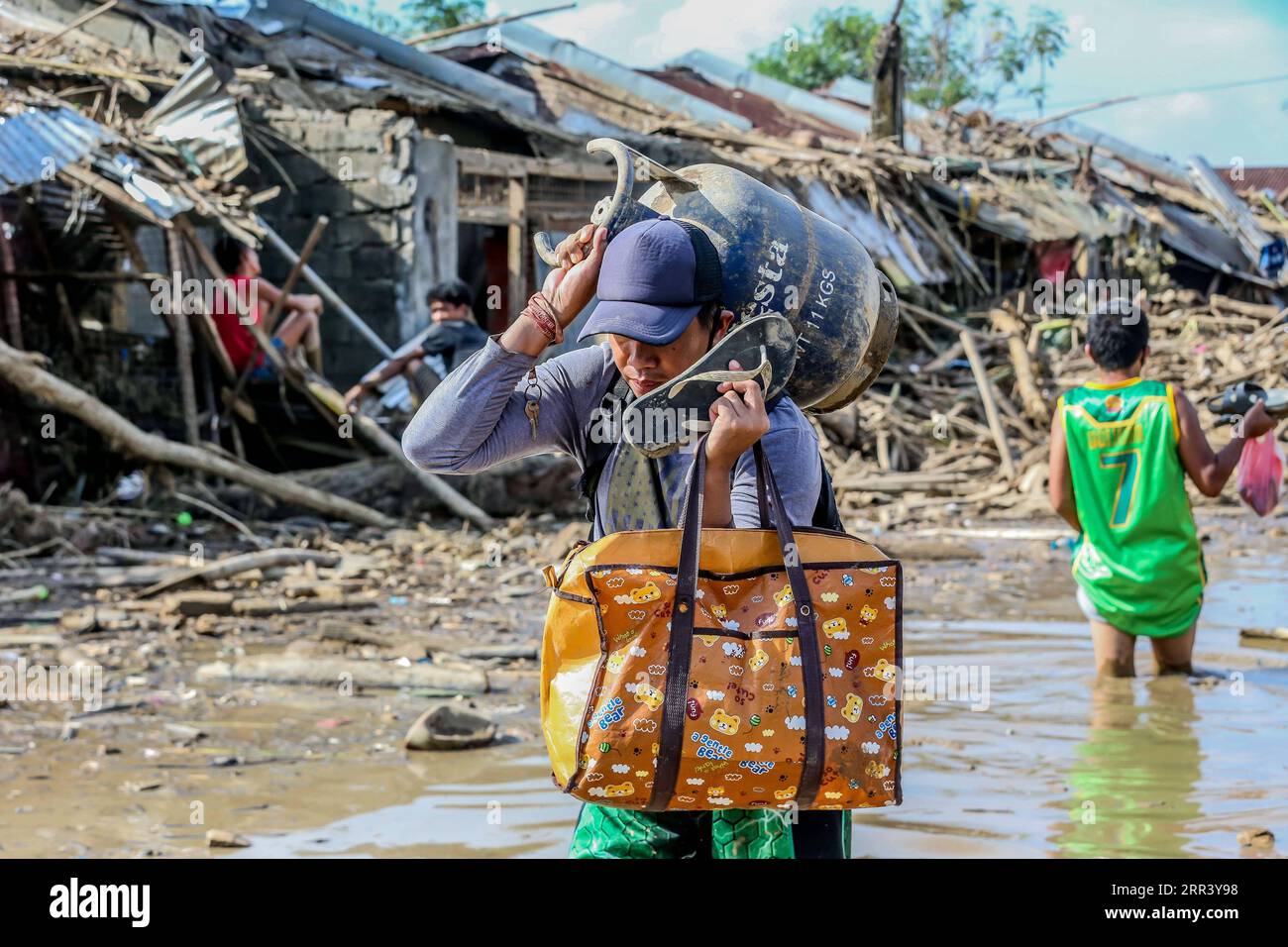 201114 -- RIZAL PROVINCE, Nov. 14, 2020 -- Residents walk in knee-deep ...