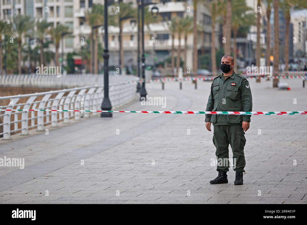 201115 -- BEIRUT, Nov. 15, 2020 -- A police officer stands guard at a ...