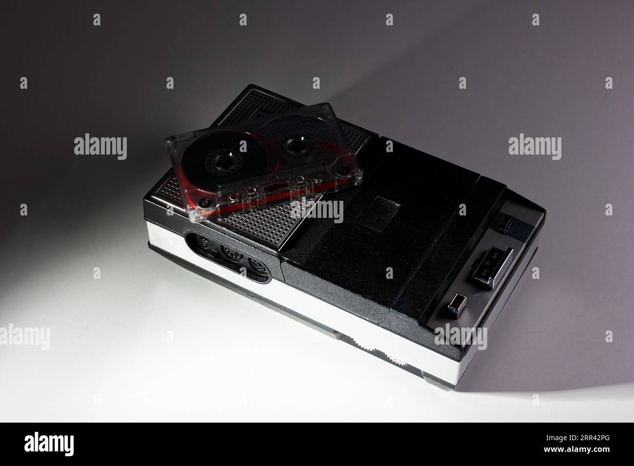 vintage analog audio cassette with transparent case and visible tape ...