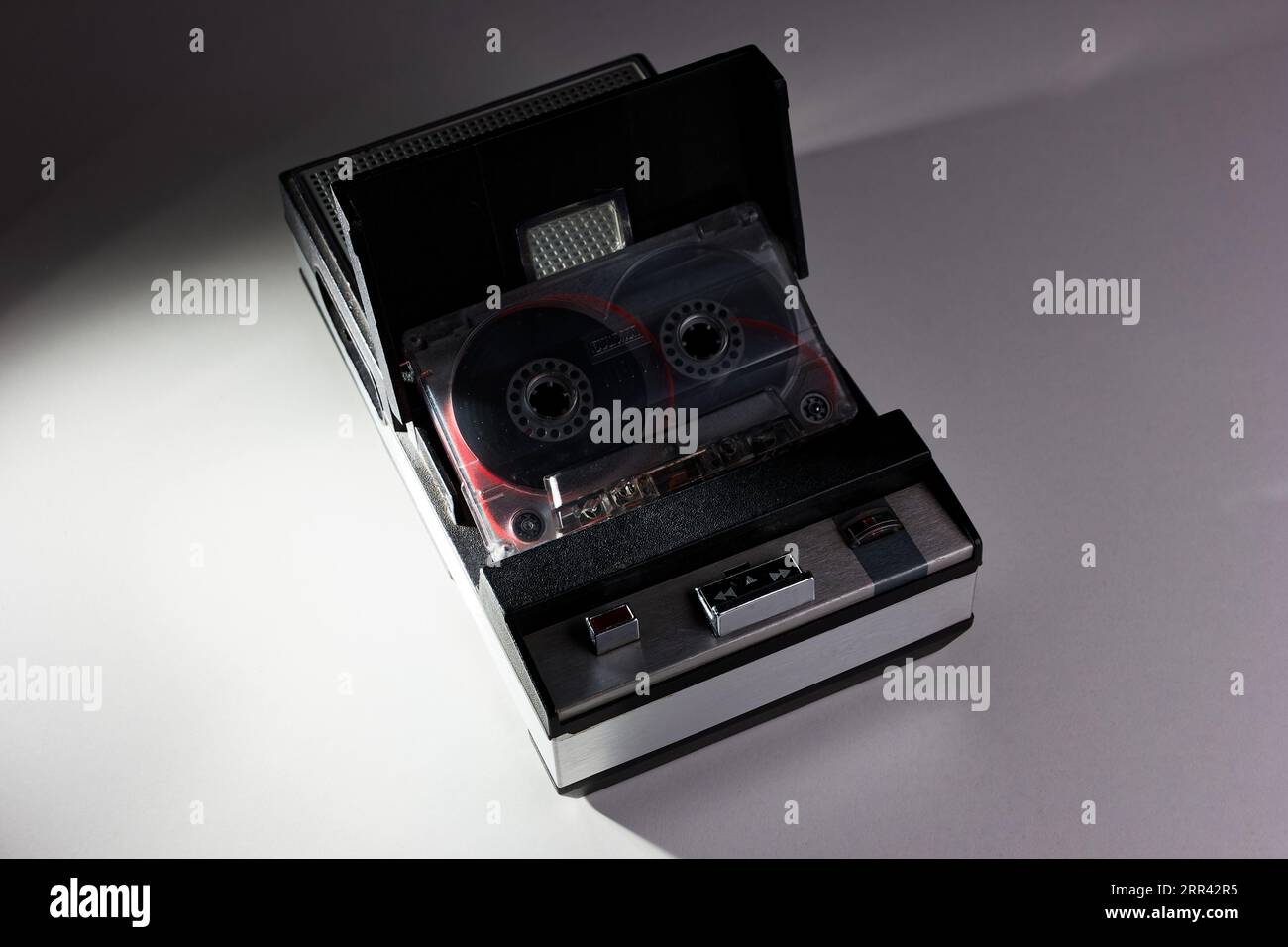 vintage analog audio cassette with transparent case and visible tape ...