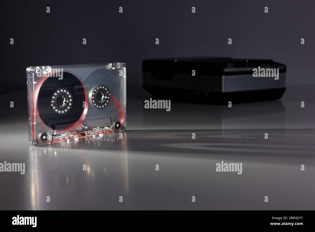 vintage analog audio cassette with transparent case and visible tape ...