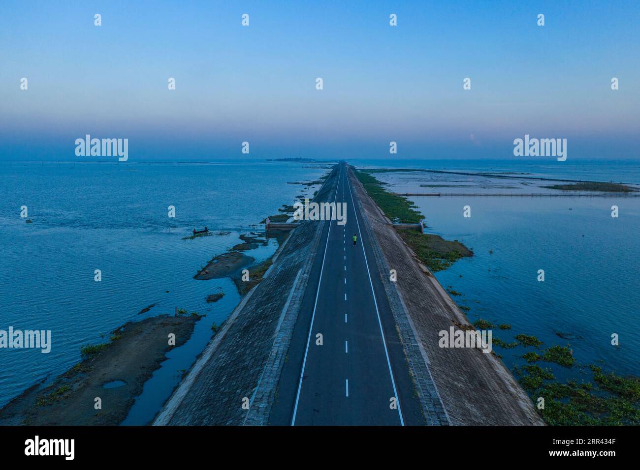Itna-Mithamoin-Austagram all-weather road goes straight through a vast ...