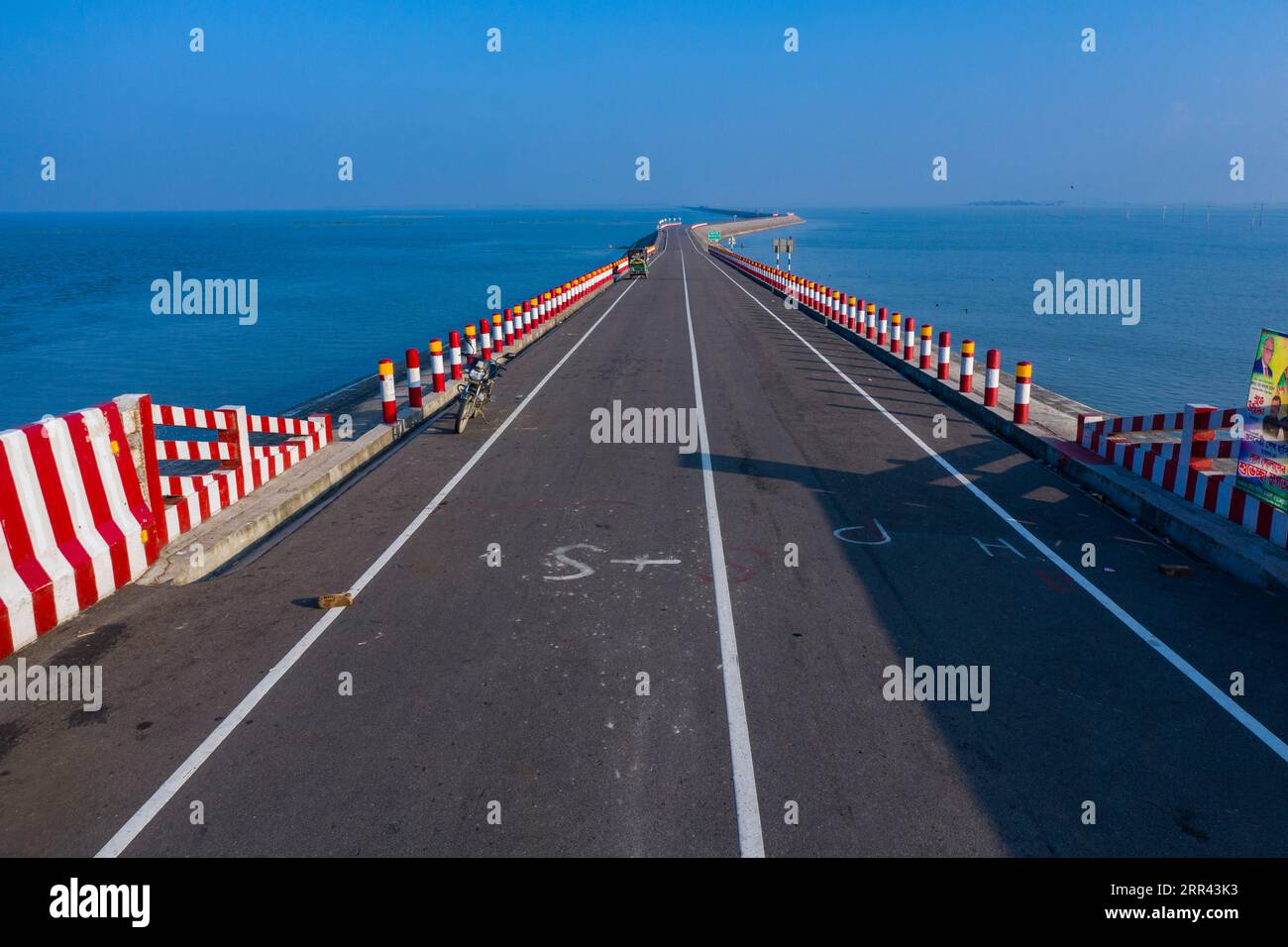 Itna-Mithamoin-Austagram all-weather road goes straight through a vast ...