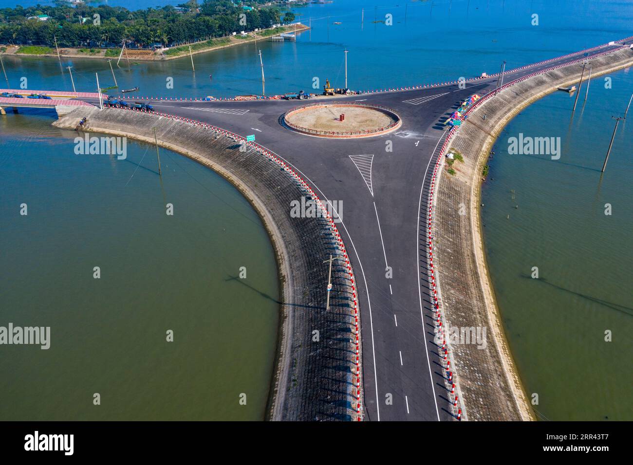 Itna-Mithamoin-Austagram all-weather road goes straight through a vast haor area in parallel ...