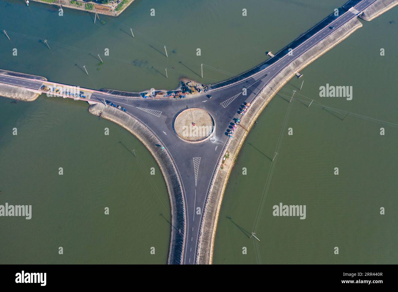 Itna-Mithamoin-Austagram all-weather road goes straight through a vast haor area in parallel ...