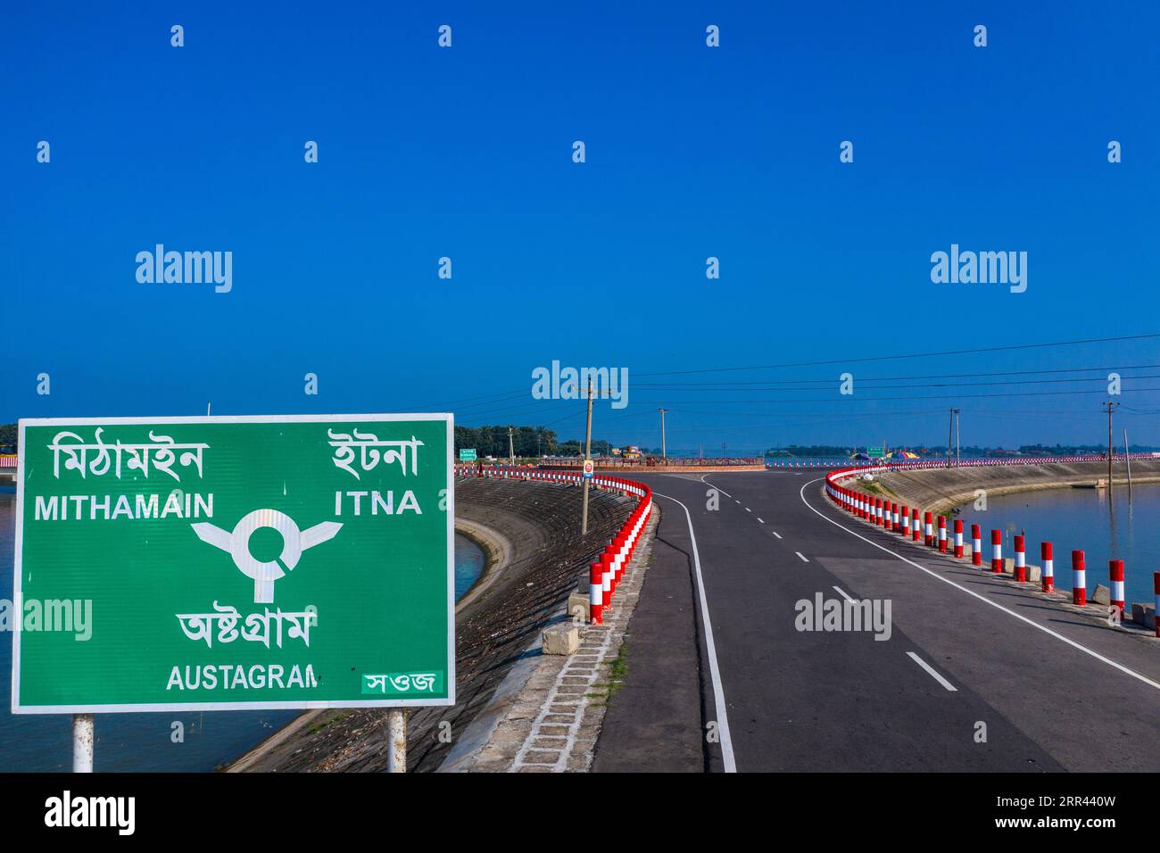 Itna-Mithamoin-Austagram all-weather road goes straight through a vast haor area in parallel ...