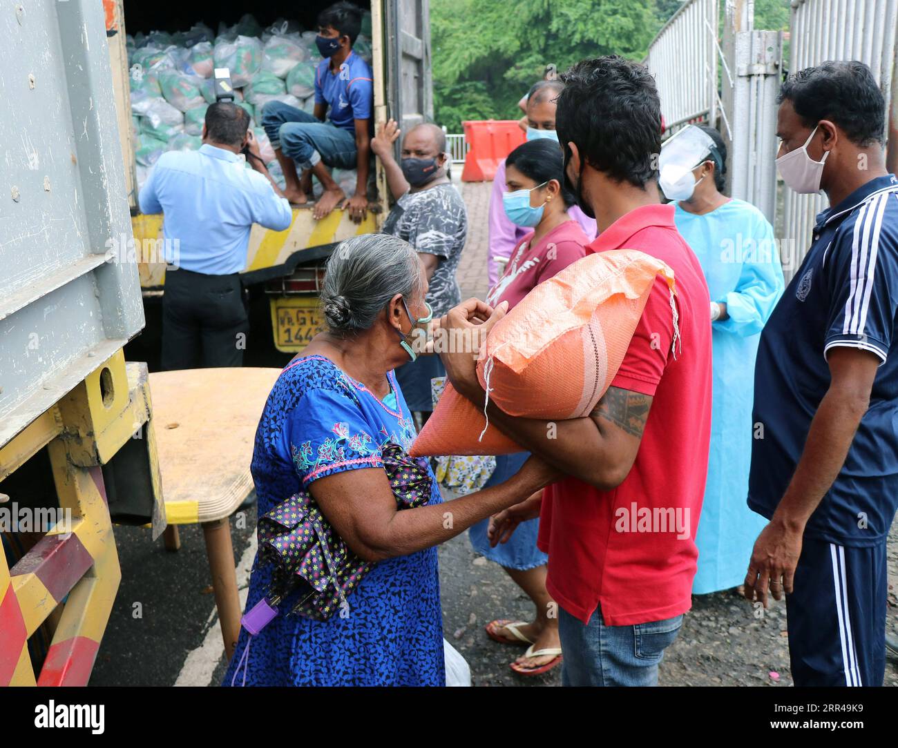 People get dry food provided by the government hi-res stock photography ...