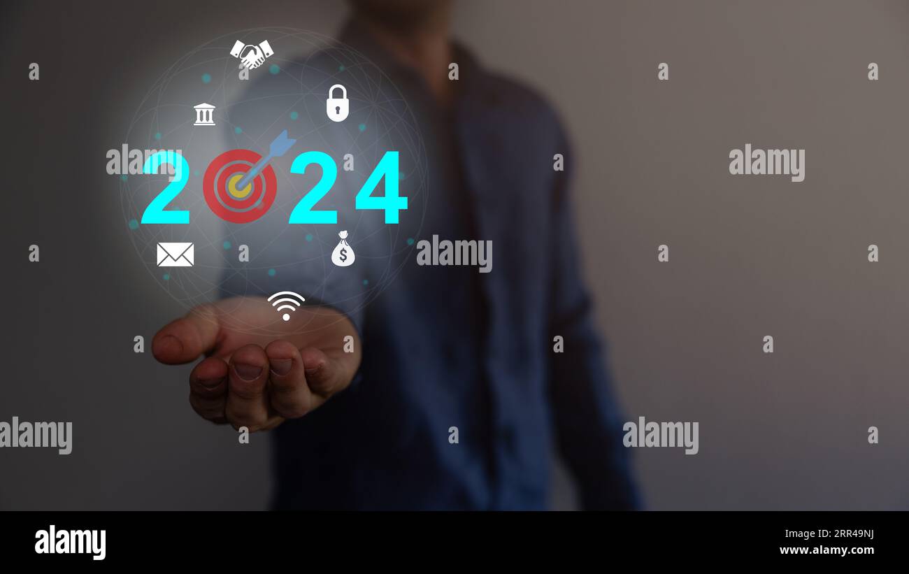 2024 business concept, business people holding goals to create an ...