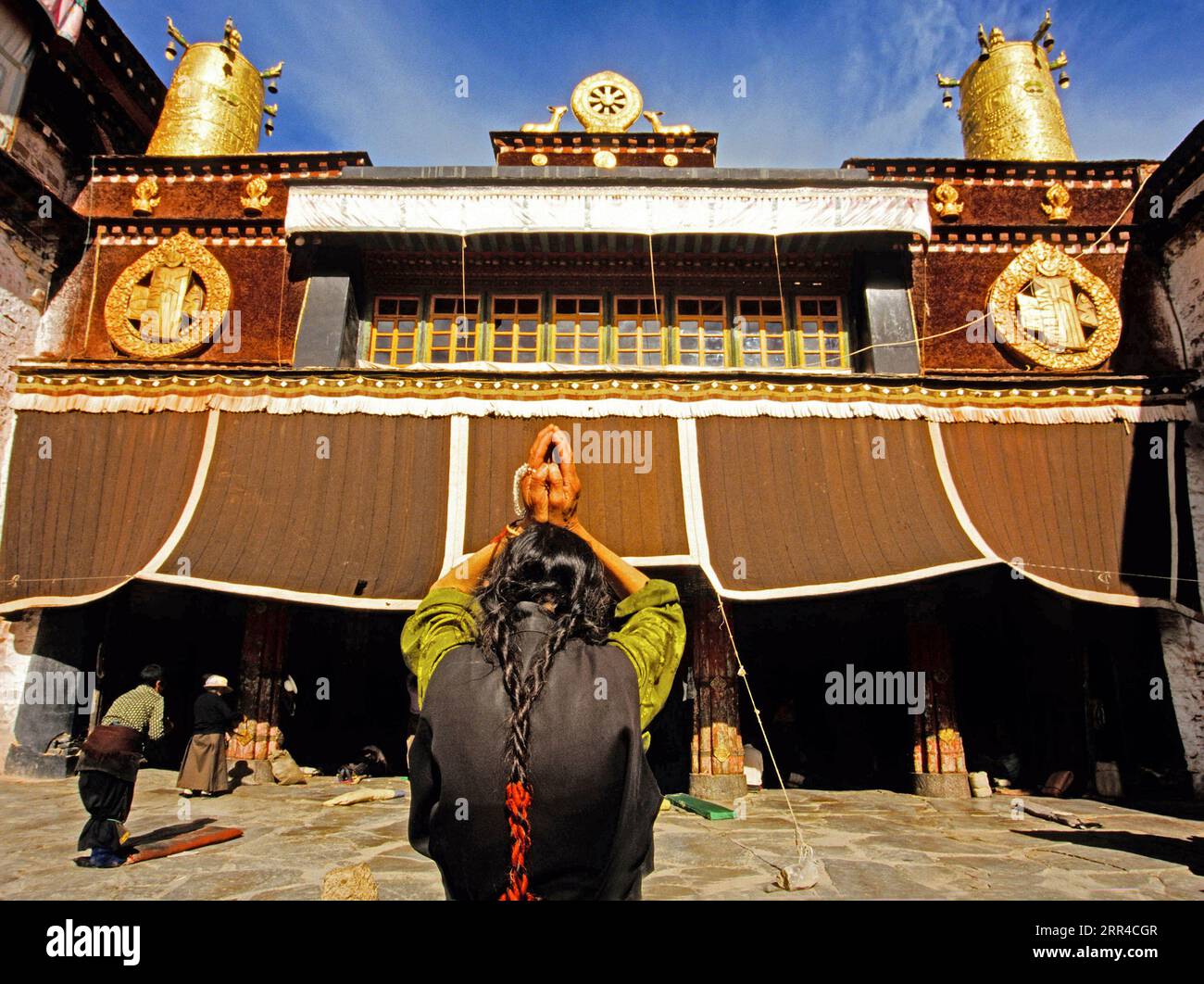 Lhasa, Tibet, China: Devout pilgrim prostrating herself before the ...