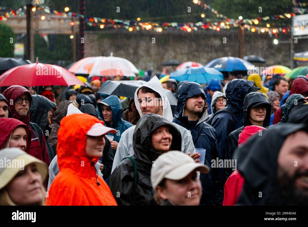 Fans looking determined to enjoy themselves in the rainstorm rain and ...