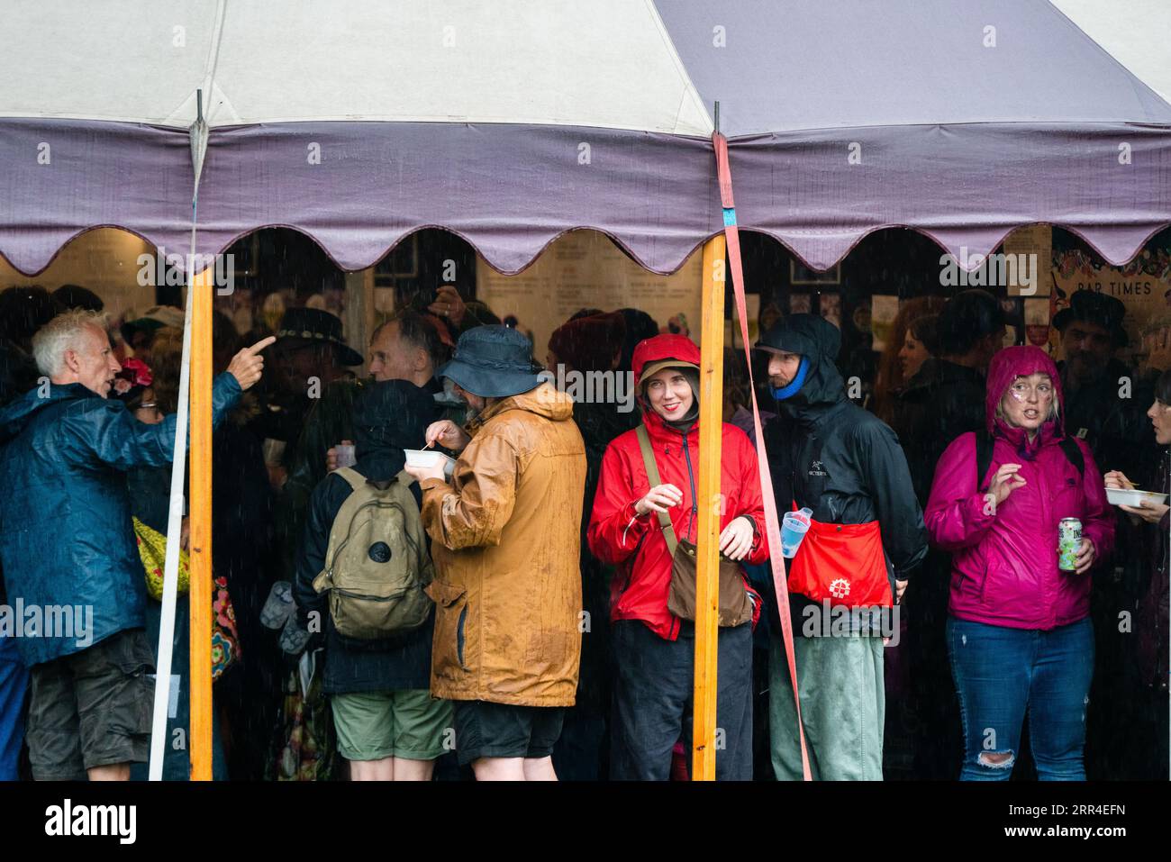 People taking cover in the bar beer tent in the Walled Garden Arena ...