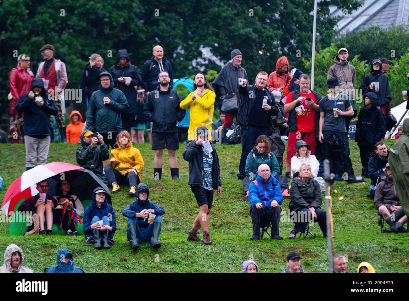 The soaking wet crowd on the hill overlooking the Mountain Stage in the ...