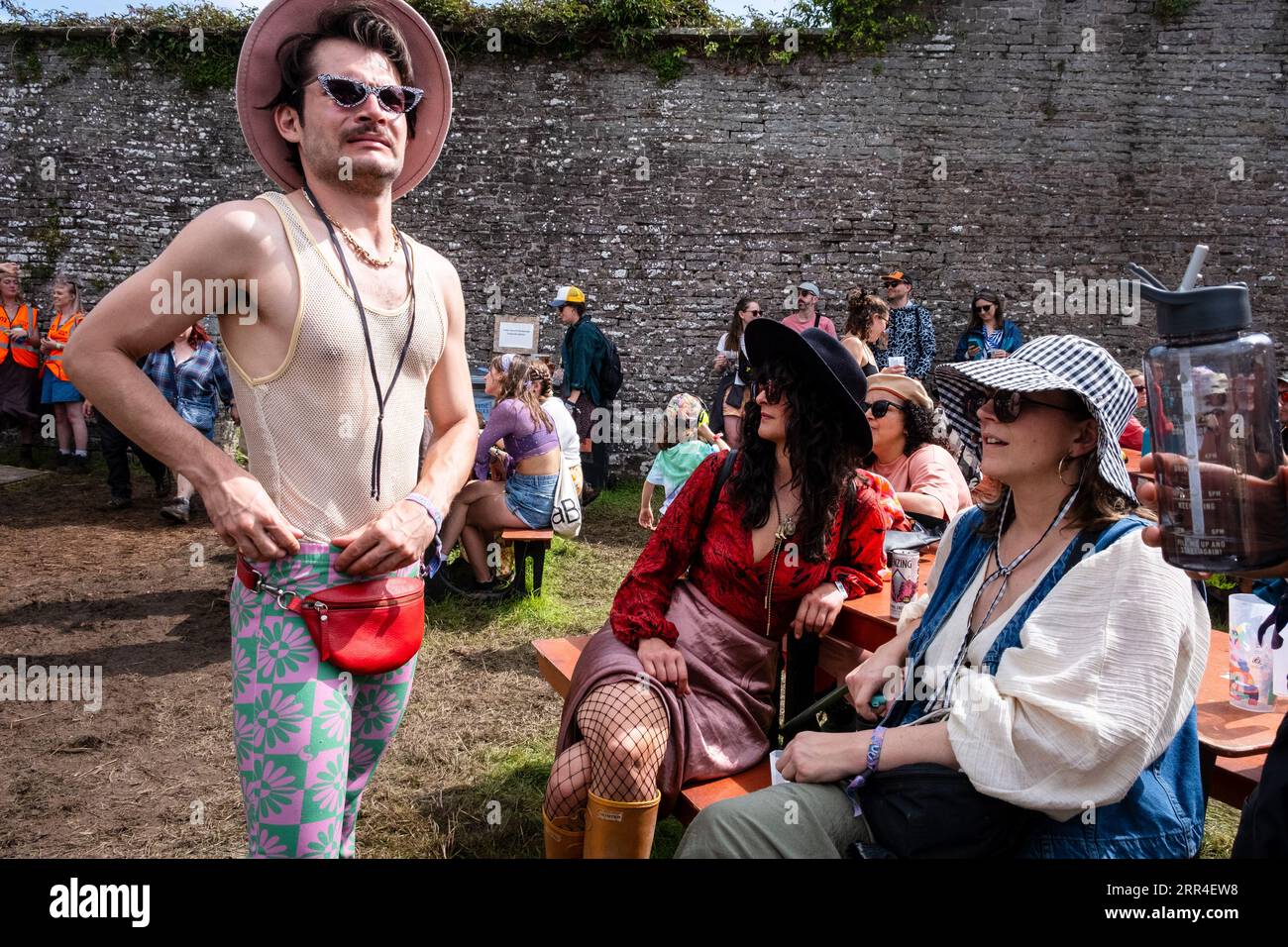 Colourfully dressed fans in the Walled Garden bar area. Green Man ...