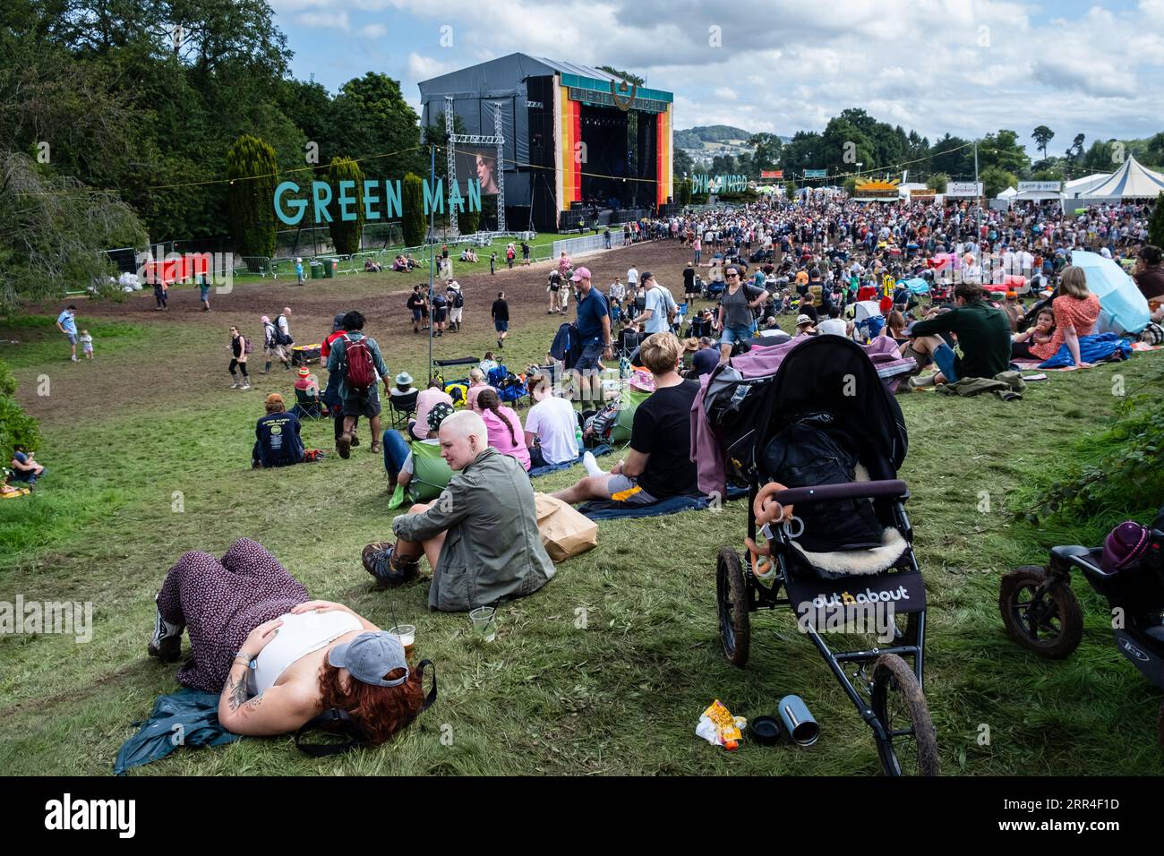 A woman taking a nap on the hill opposite the main Mountain Stage at ...