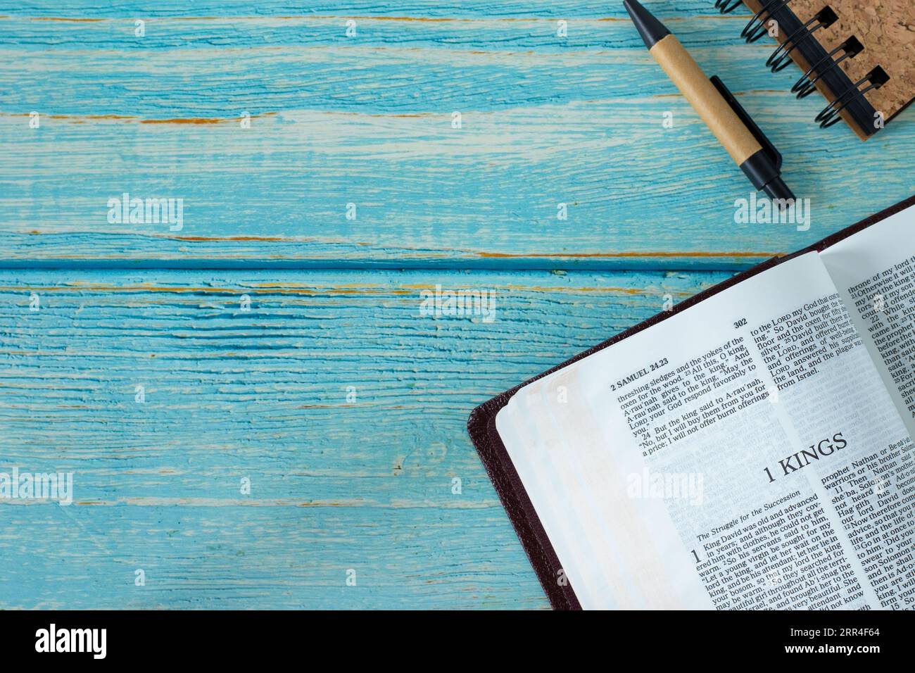 1 Kings open Holy Bible Book on a rustic wooden background with copy ...