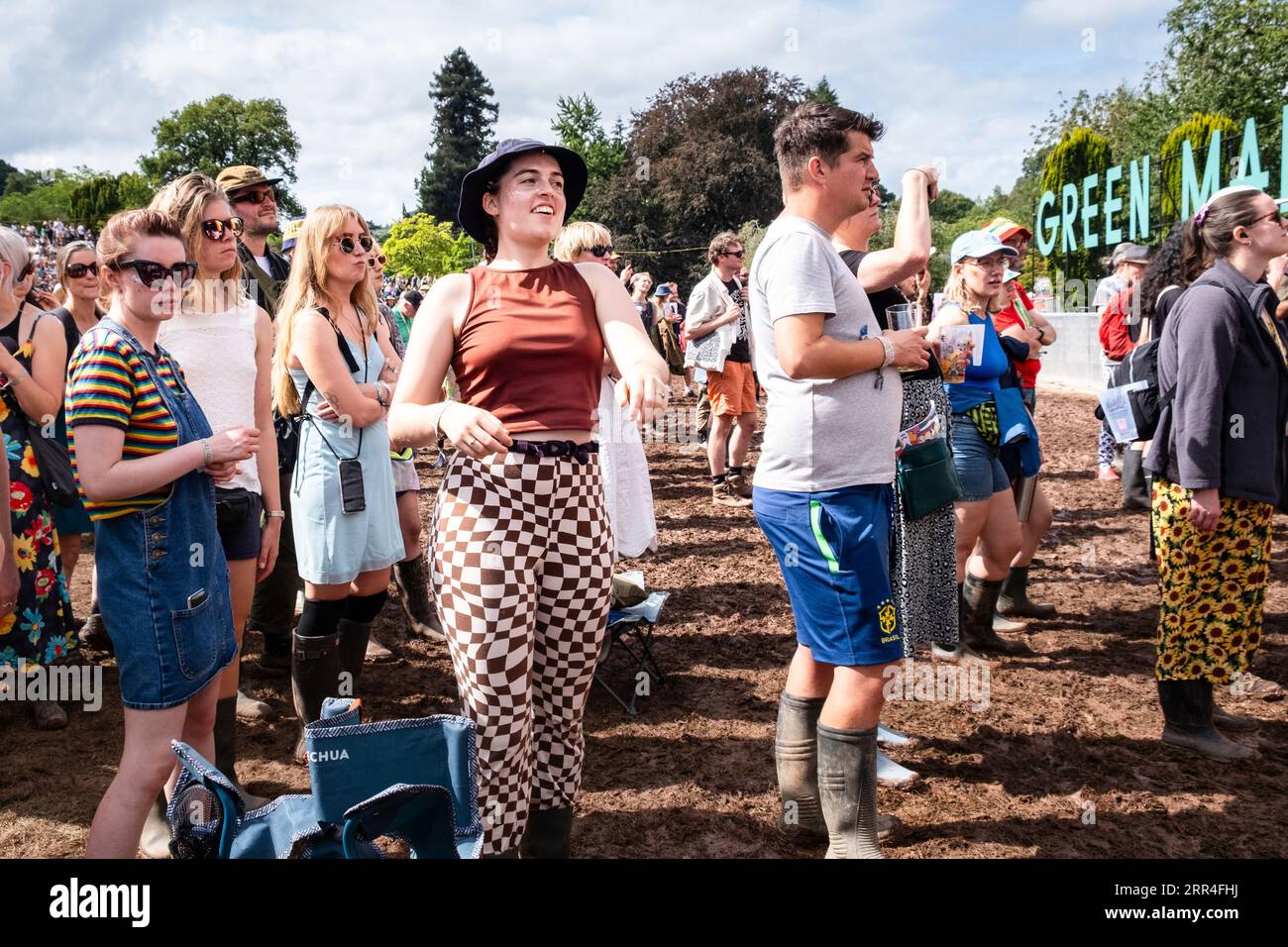 The crowd dancing at the Mountain Stage in sunshine after rain at Green ...