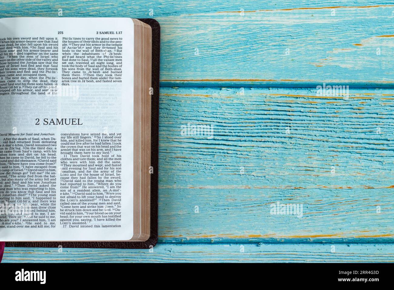 2 Samuel open Holy Bible Book on a rustic wooden background with copy ...