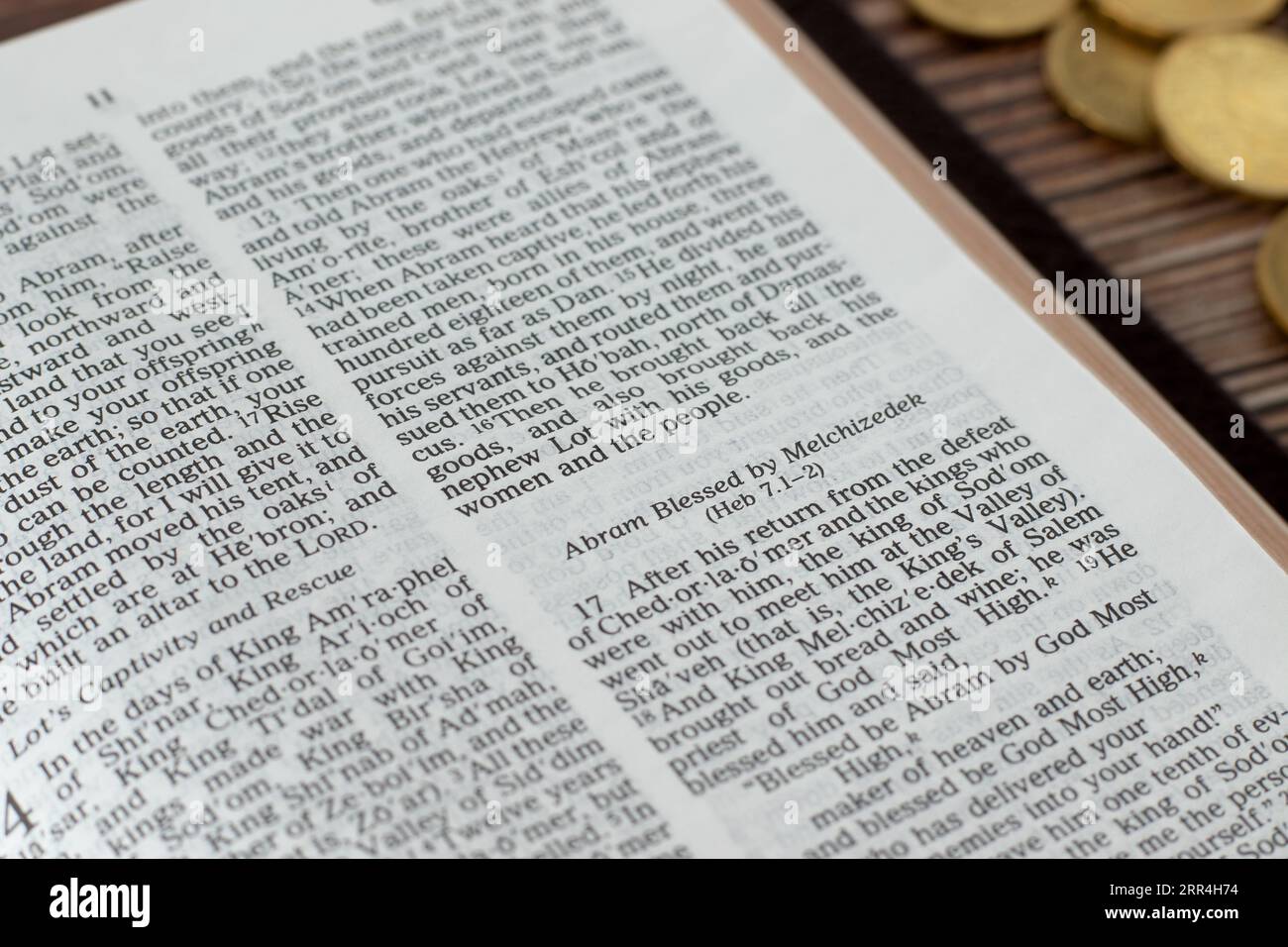 Abram blessed by Melchizedek verses in open holy bible genesis book. A ...