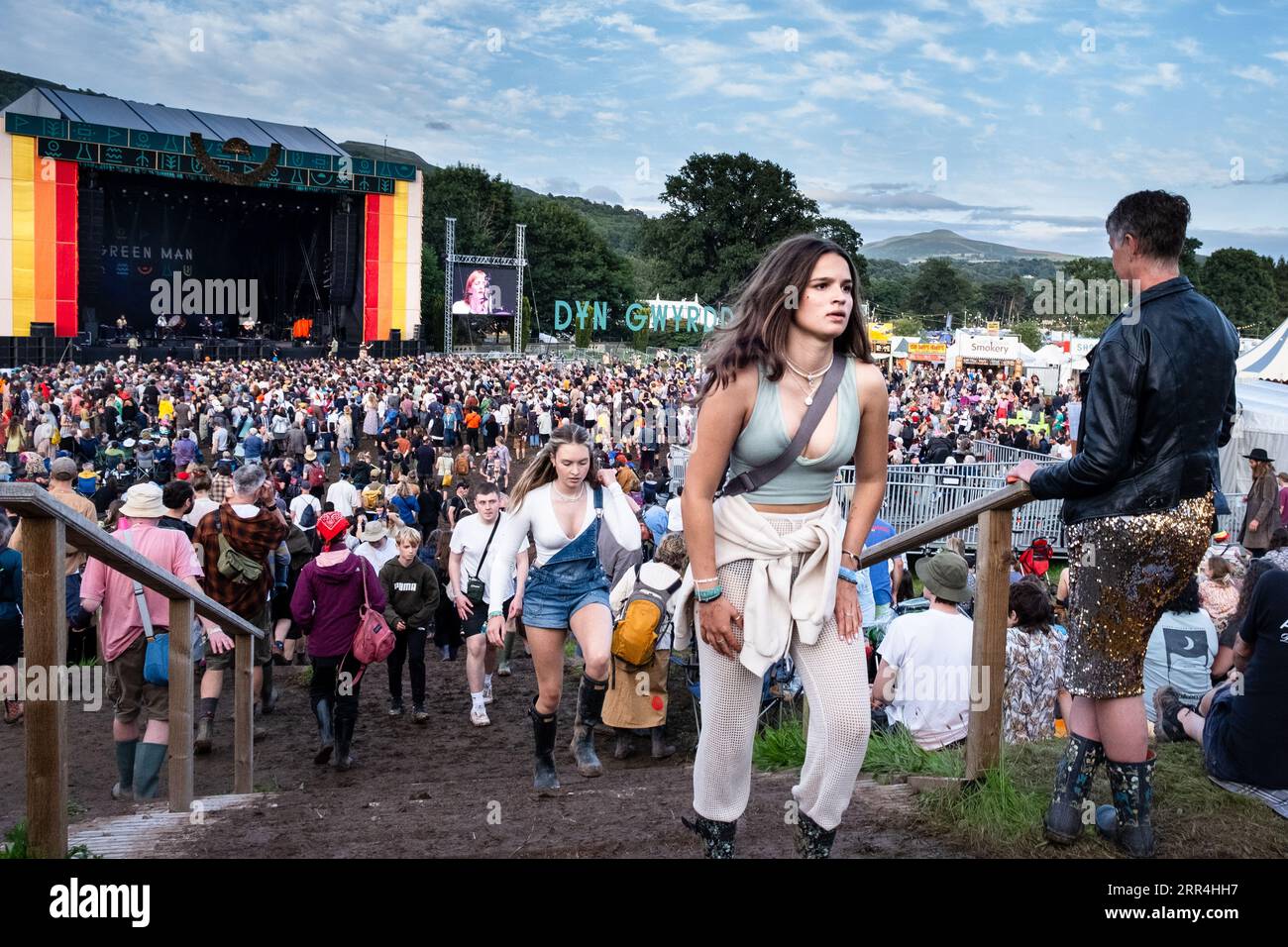 Young people on the muddy steps leading from the main Mountain Stage at ...
