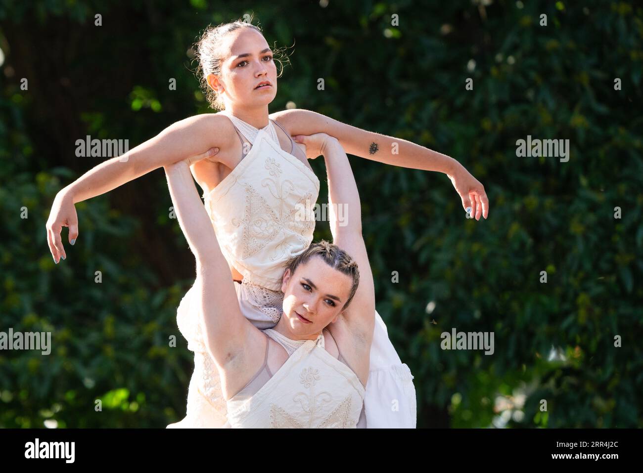 Strong acrobatic woman lifting man hi-res stock photography and images ...