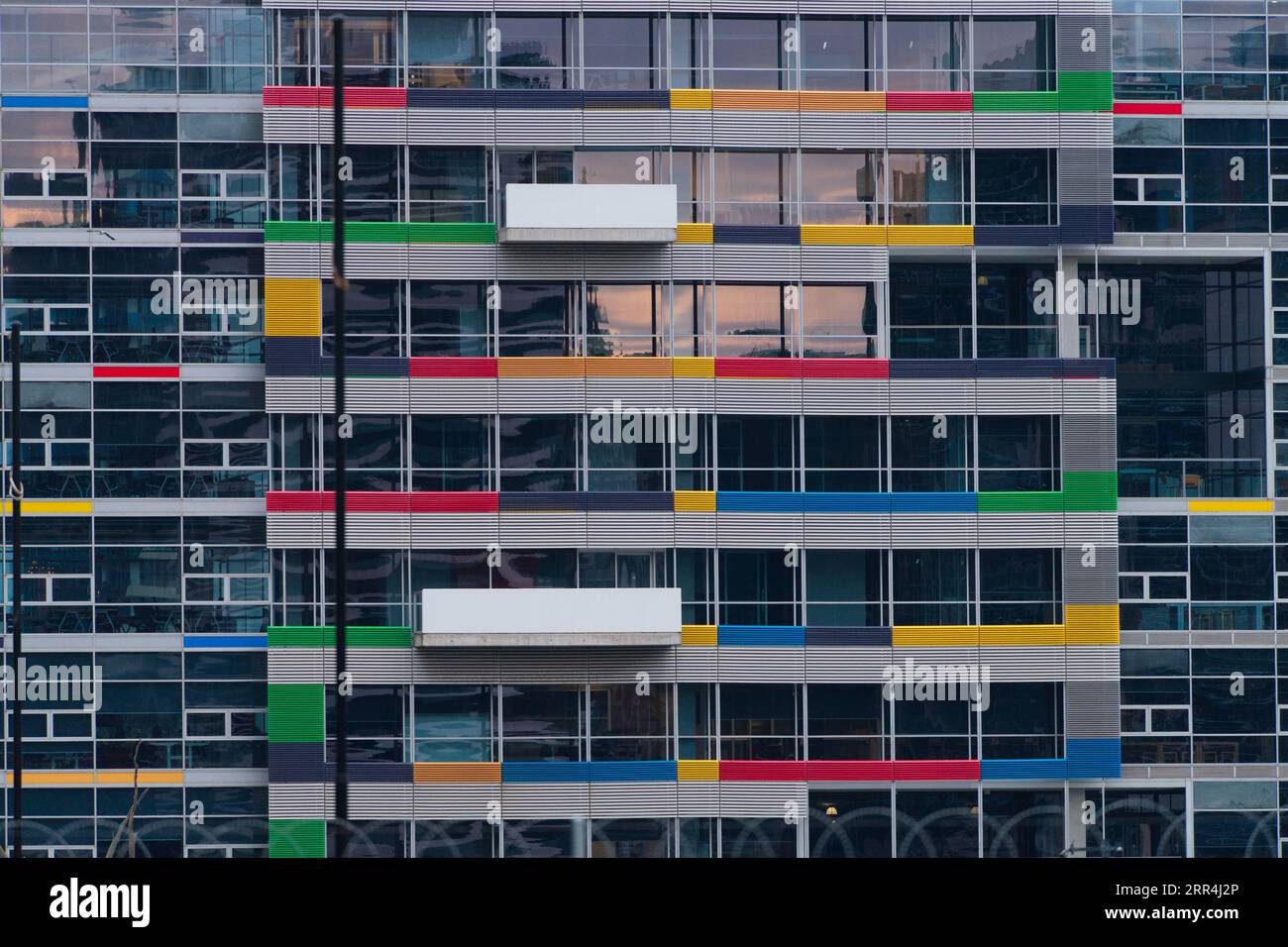 Office building day time view showing glass window patterns and colour ...