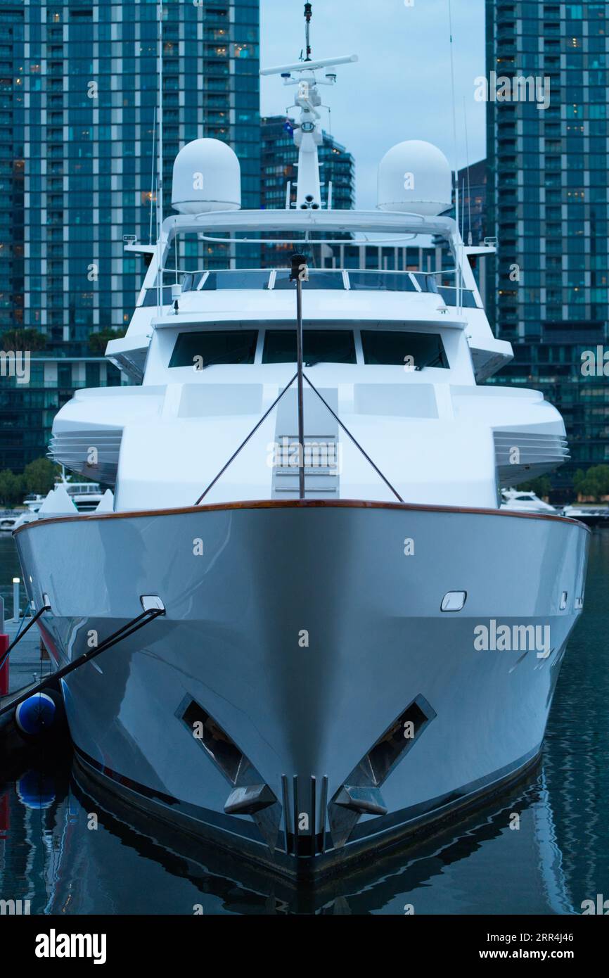 Luxury boat front view docked at Melbourne docklands in evening with ...