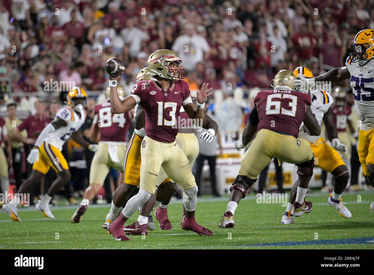 Florida State quarterback Jordan Travis (13) throws a pass in front of ...