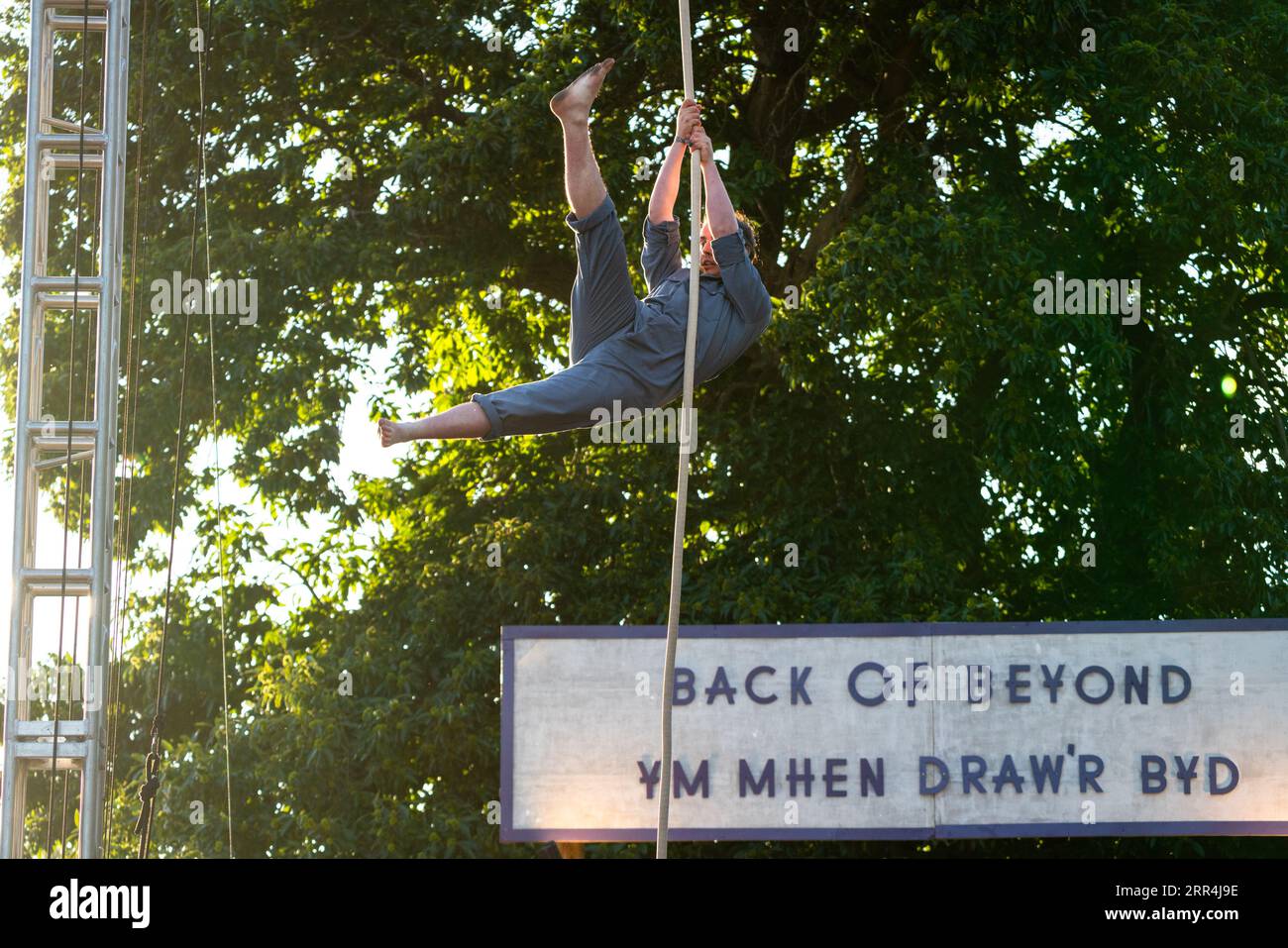 An acrobatic high wire act on the Back of Beyond Stage at Green Man ...