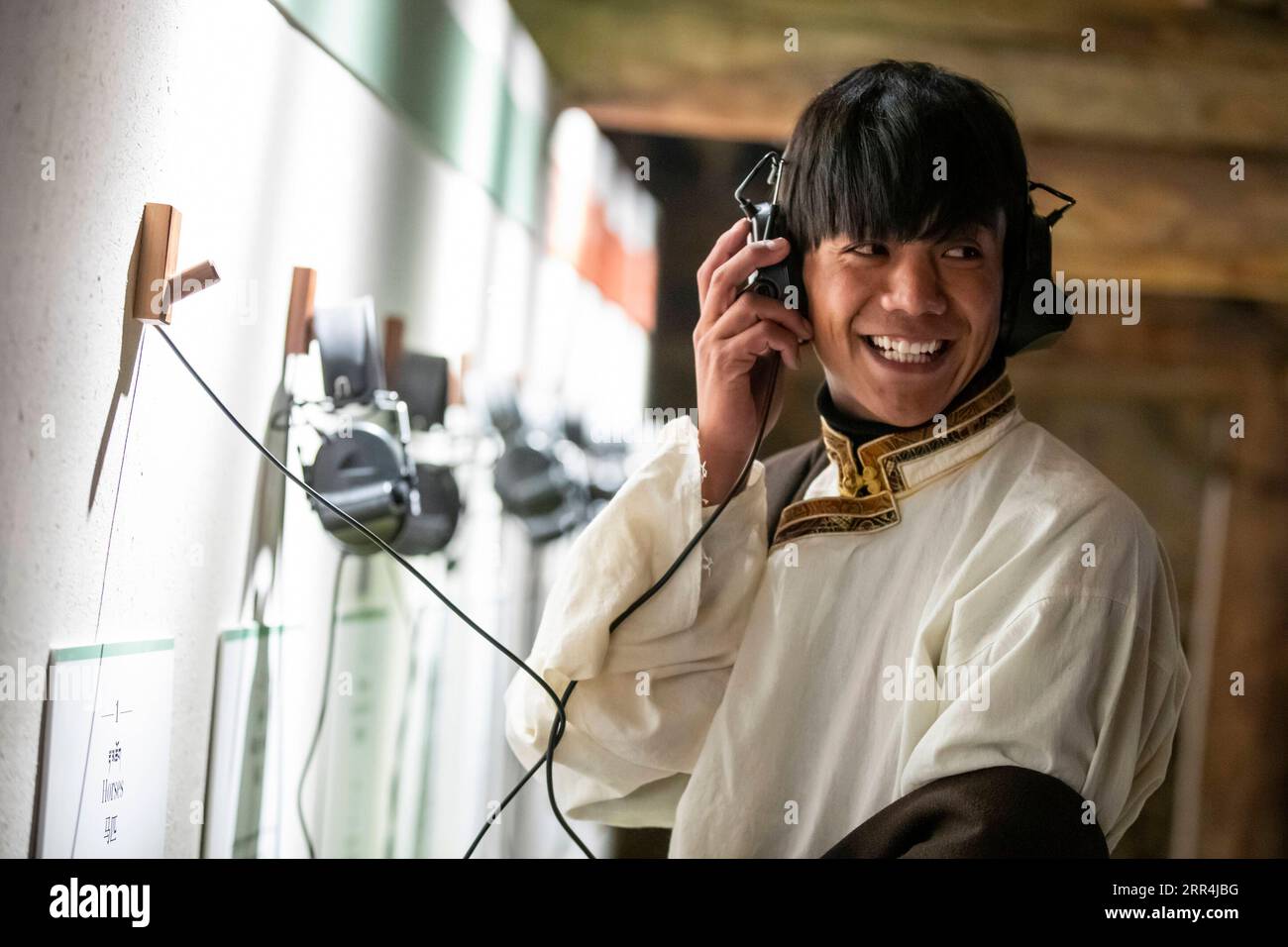 201206 CHENGDU Dec. 6 2020 Tamdrin listens to the sound of horse at the Sounds of Himalaya Museum in Letong Town of Litang County the Tibetan Autonomous Prefecture of Garze
